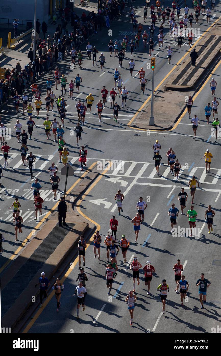 Runners jog through the Park Slope neighborhood of Brooklyn, New York ...
