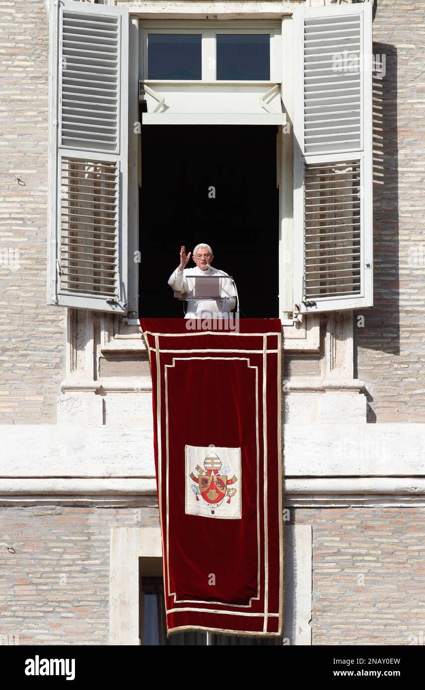 Pope Benedict XVI delivers his blessing during the Angelus prayer from ...