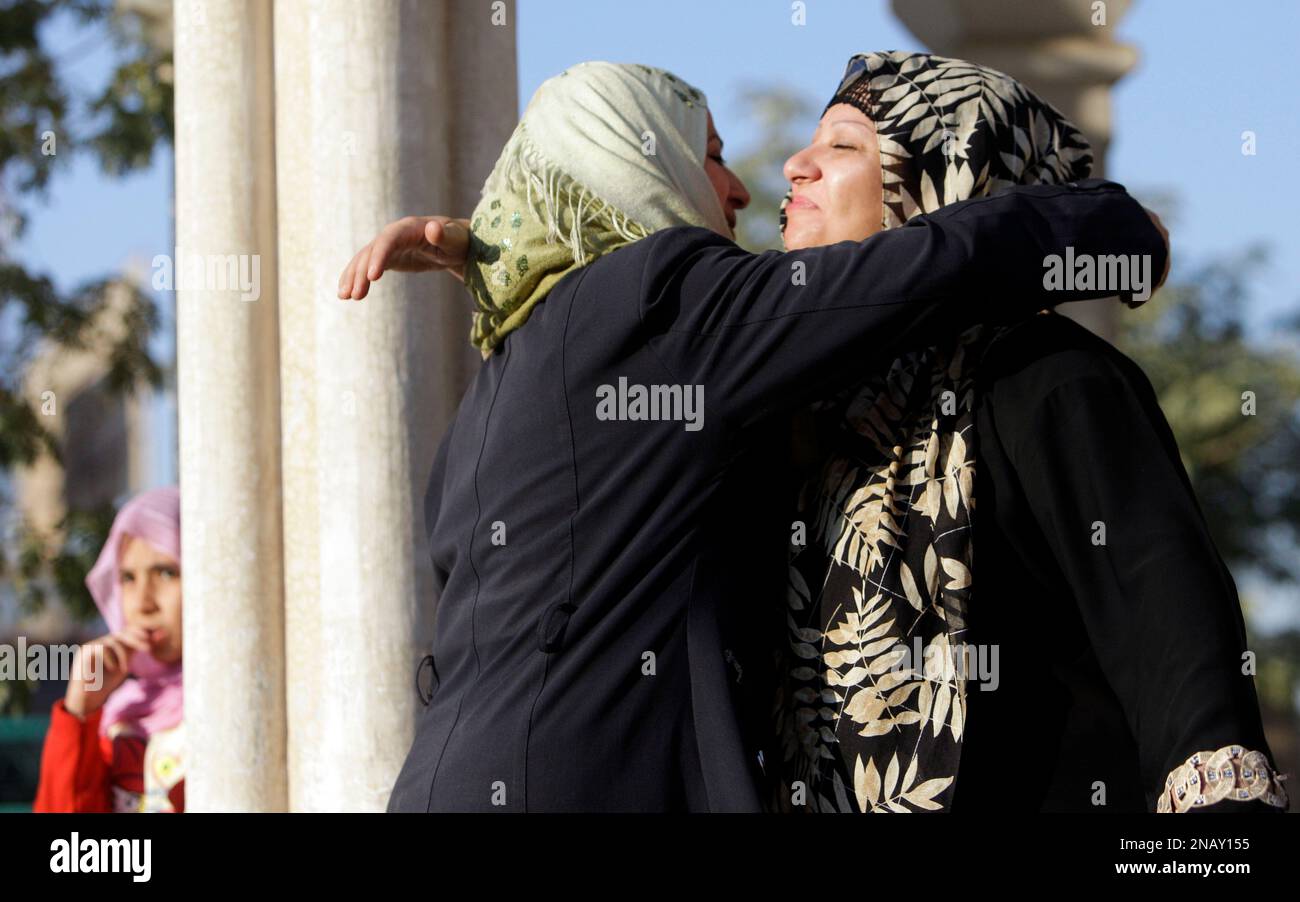 Iraqi Muslims exchange greetings after Eid prayers outside the 14th ...