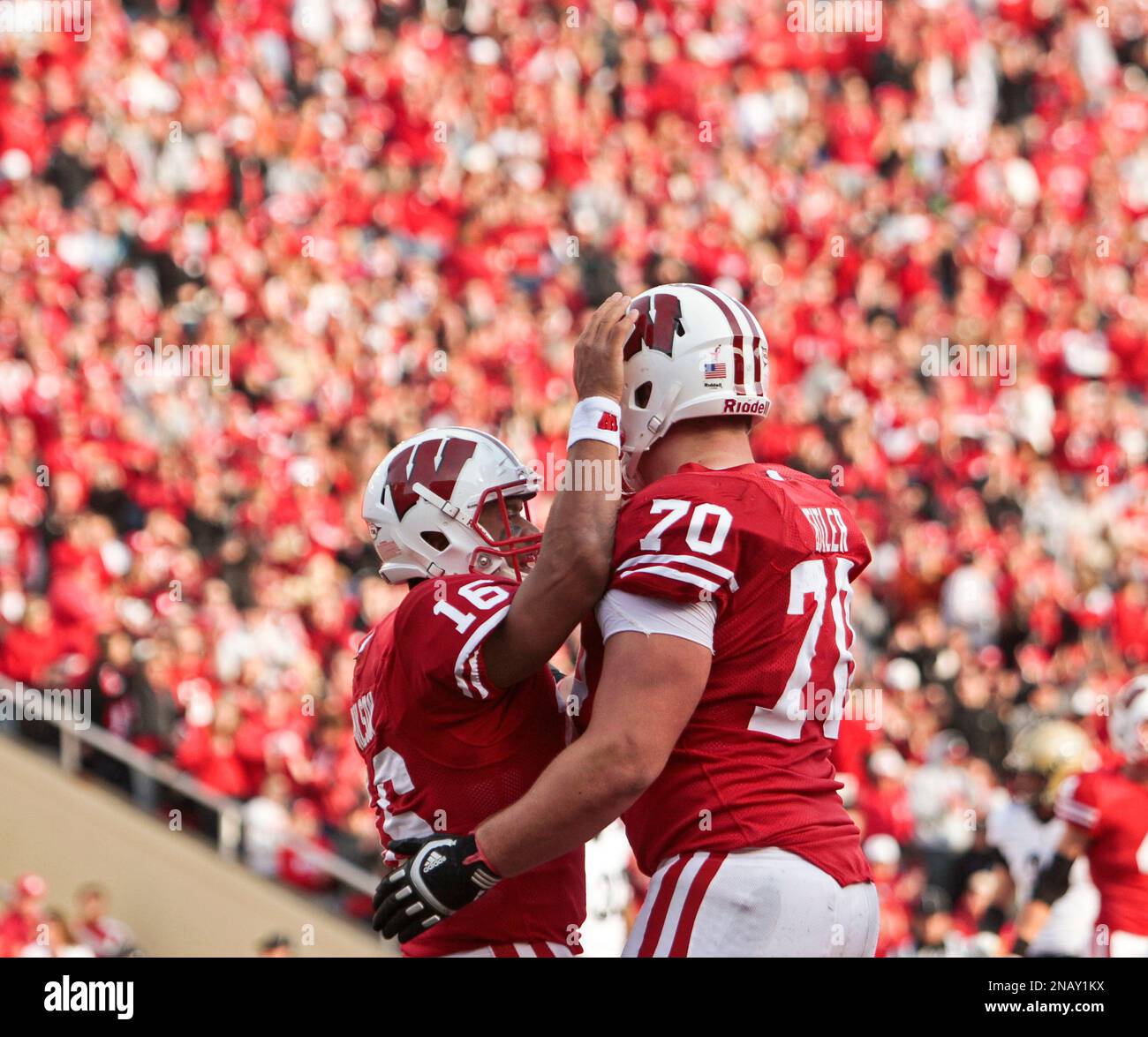 Wisconsin quarterback Russell Wilson (16) celebrates his touchdown with ...