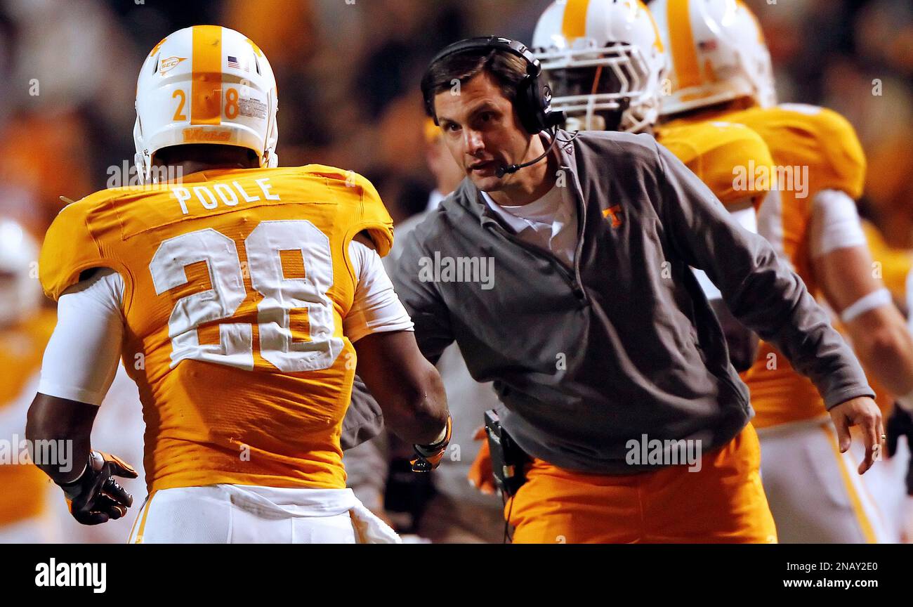 Tennessee head coach Derek Dooley, right, congratulates Tauren Poole ...