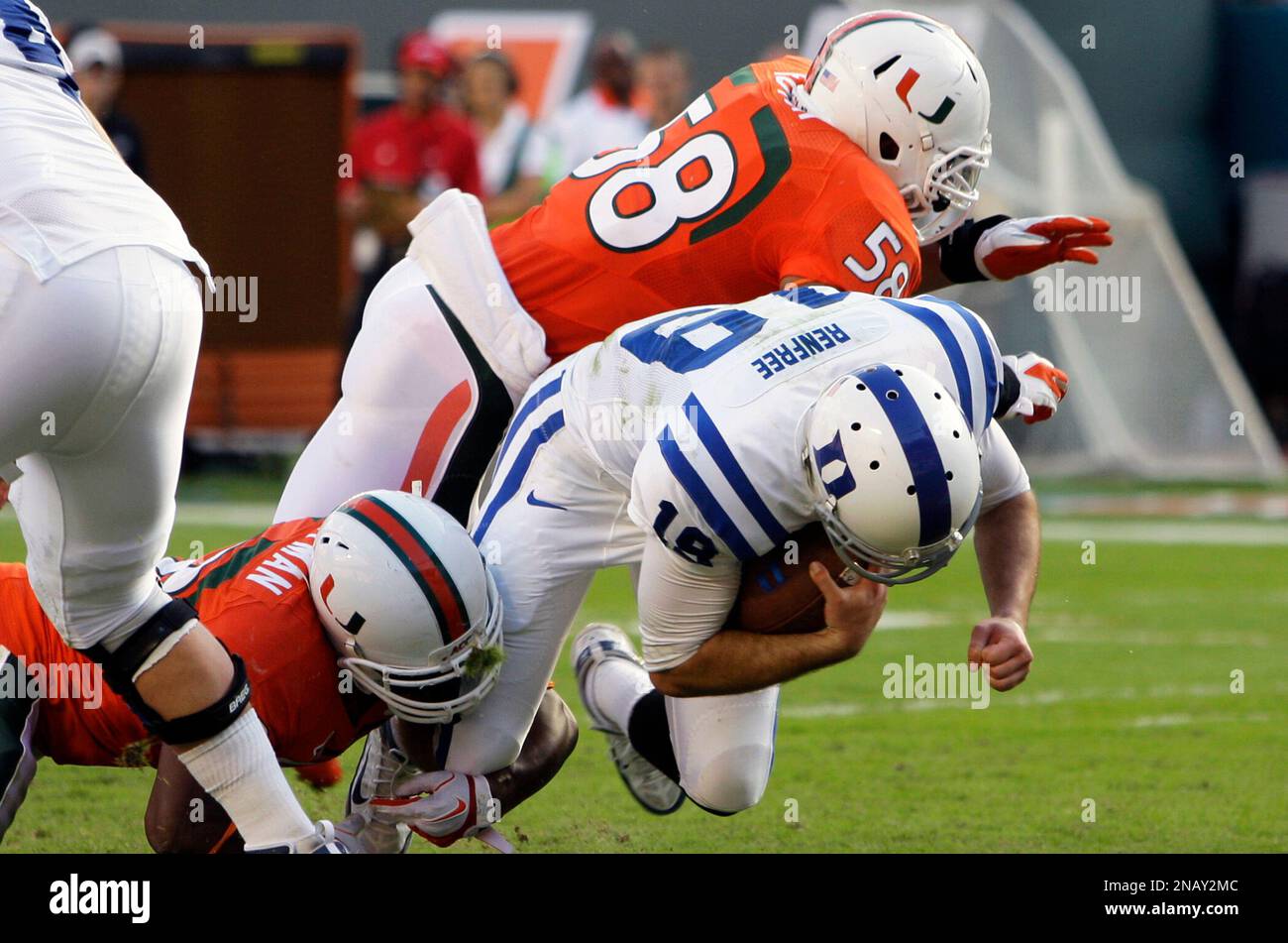 Duke quarterback Sean Renfree (19) gets past Miami linebacker Jordan ...