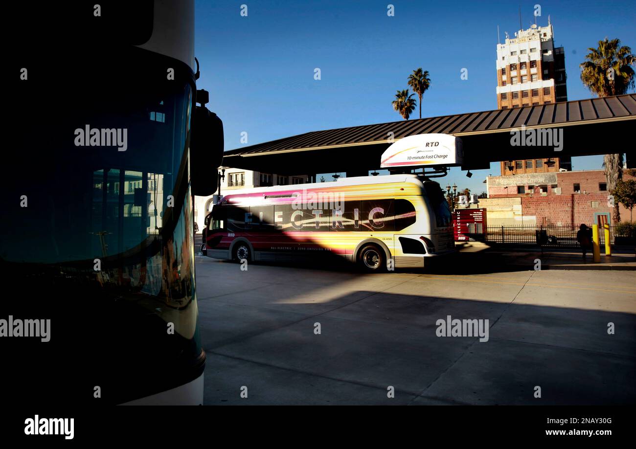 An all electric Proterra bus is seen pulling into the overhead 10 ...