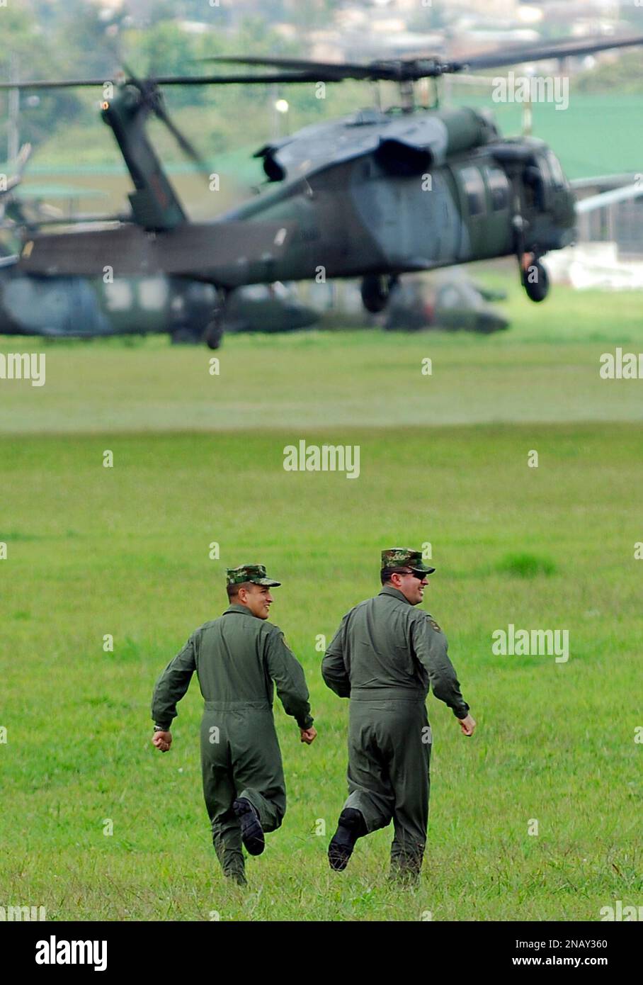 Pilots run on a field at the military base in Popayan, southeastern ...