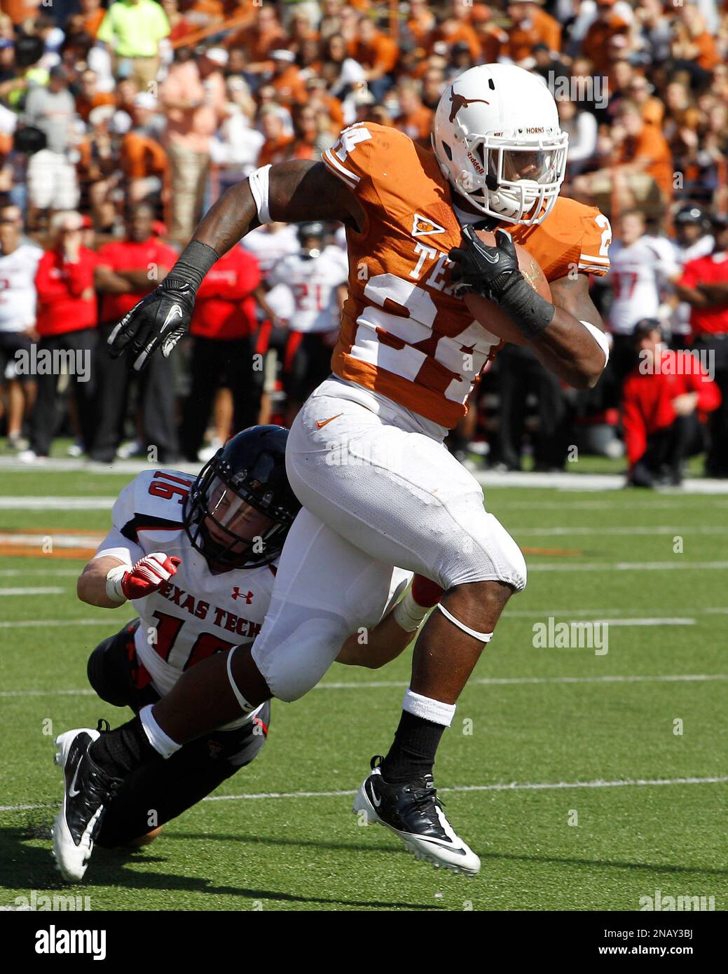 Texas' Joe Bergeron (24) runs past Texas Tech's Cody Davis (16) for a ...
