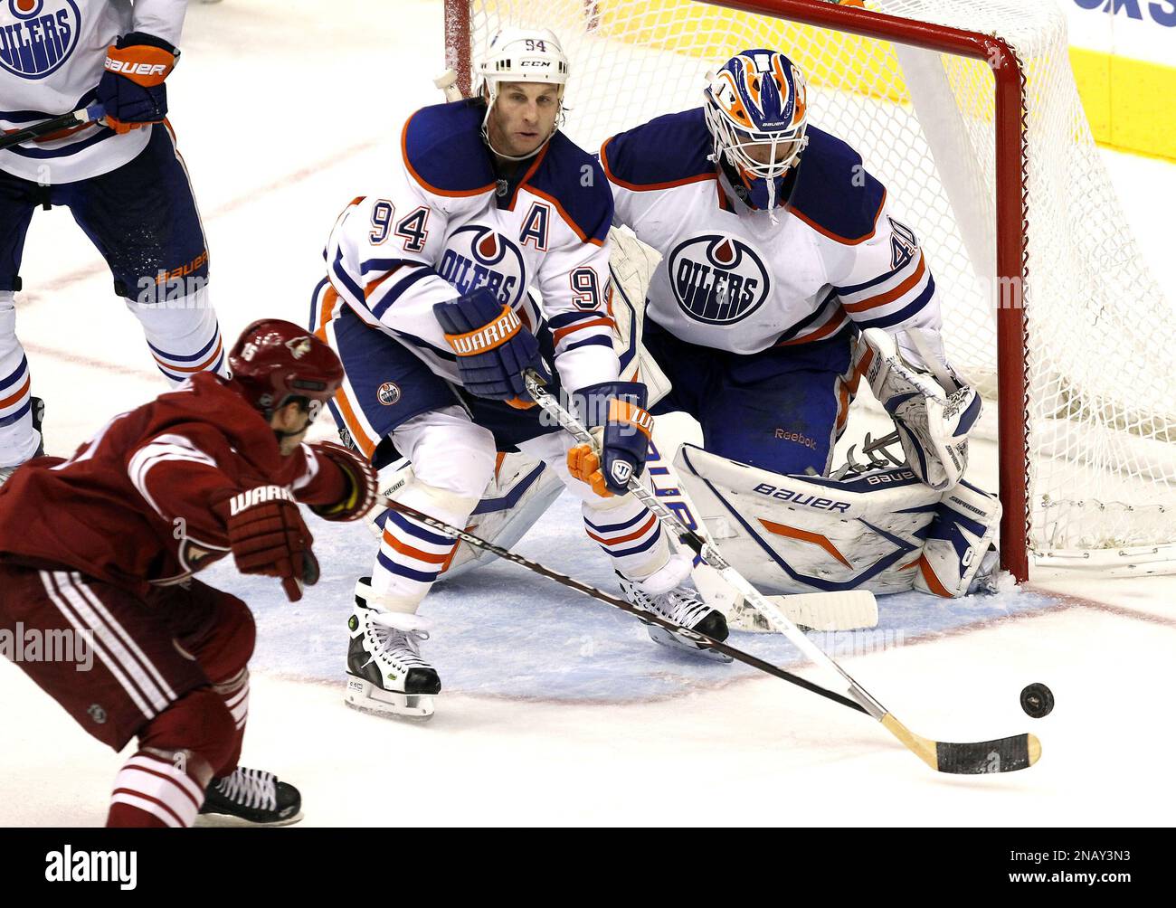 Edmonton Oilers' Ryan Smyth (94) tips the puck away on a shot by ...