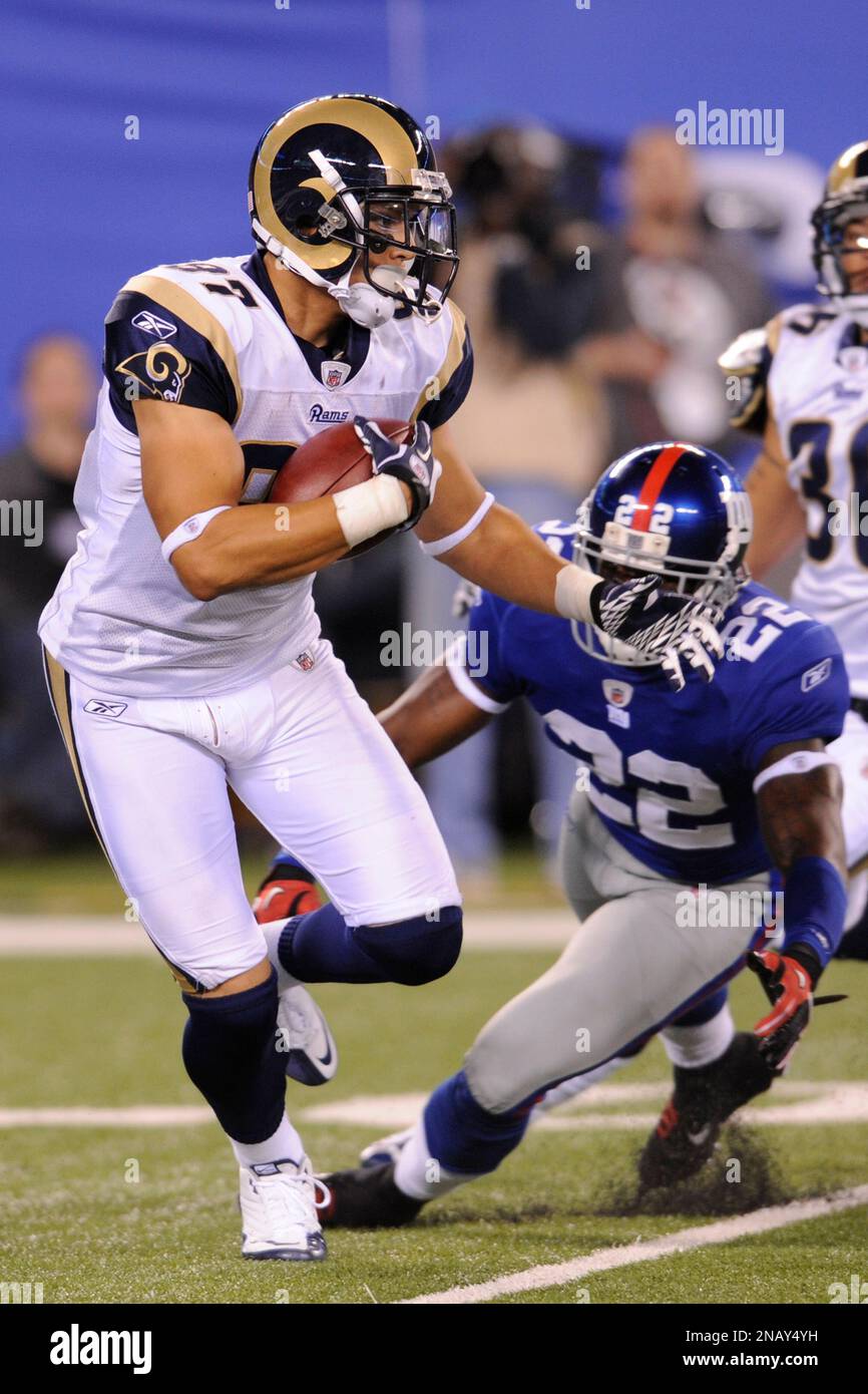 St. Louis Rams' Greg Salas avoids a tackle by New York Giants' Derrick ...