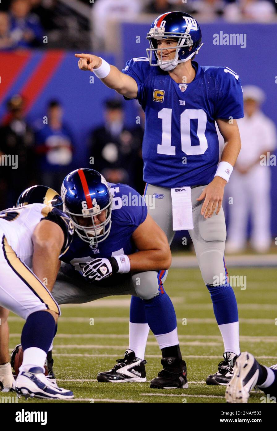 New York Giants quarterback Eli Manning (10) directs the offense behind ...
