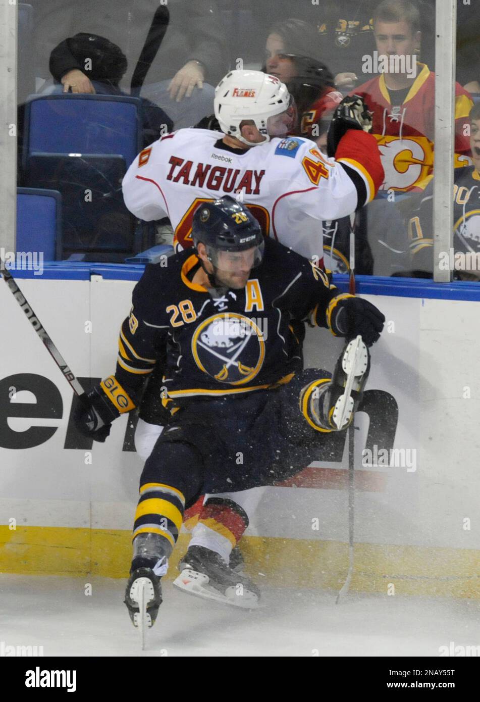 Buffalo Sabres' Paul Gaustad (28) hits Calgary Flames' Alex Tanguay (40 ...