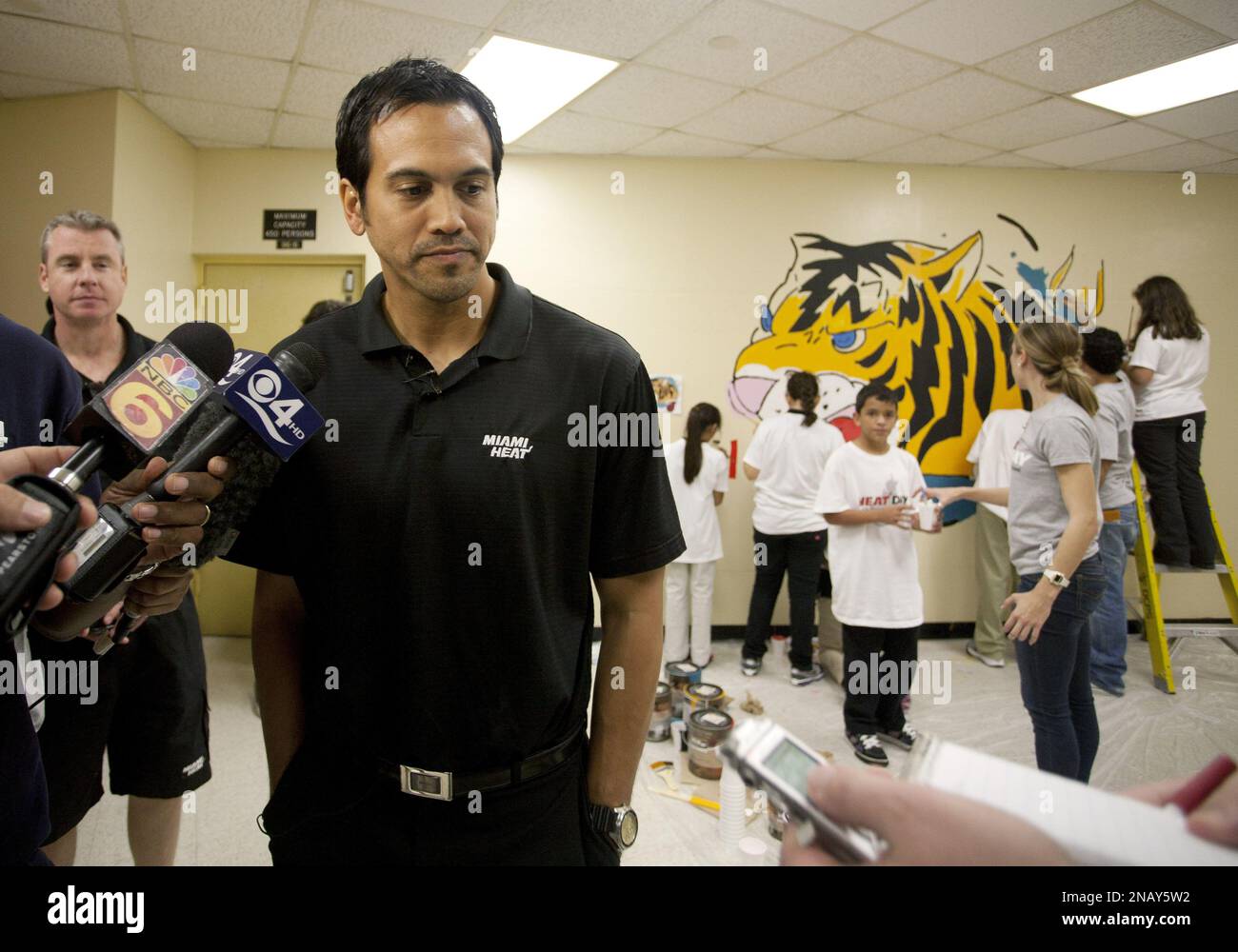 Miami Heat basketball coach Erik Spoelstra talks to the media, as a ...