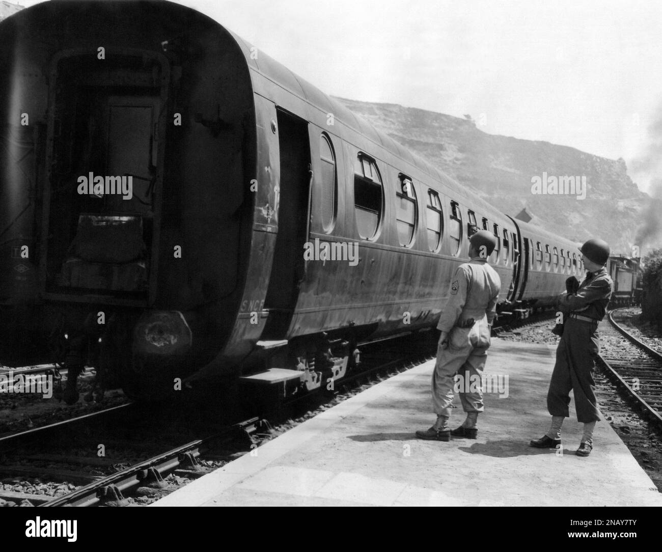 Two members of a U.S. Army railroad battalion stand by as a passenger ...