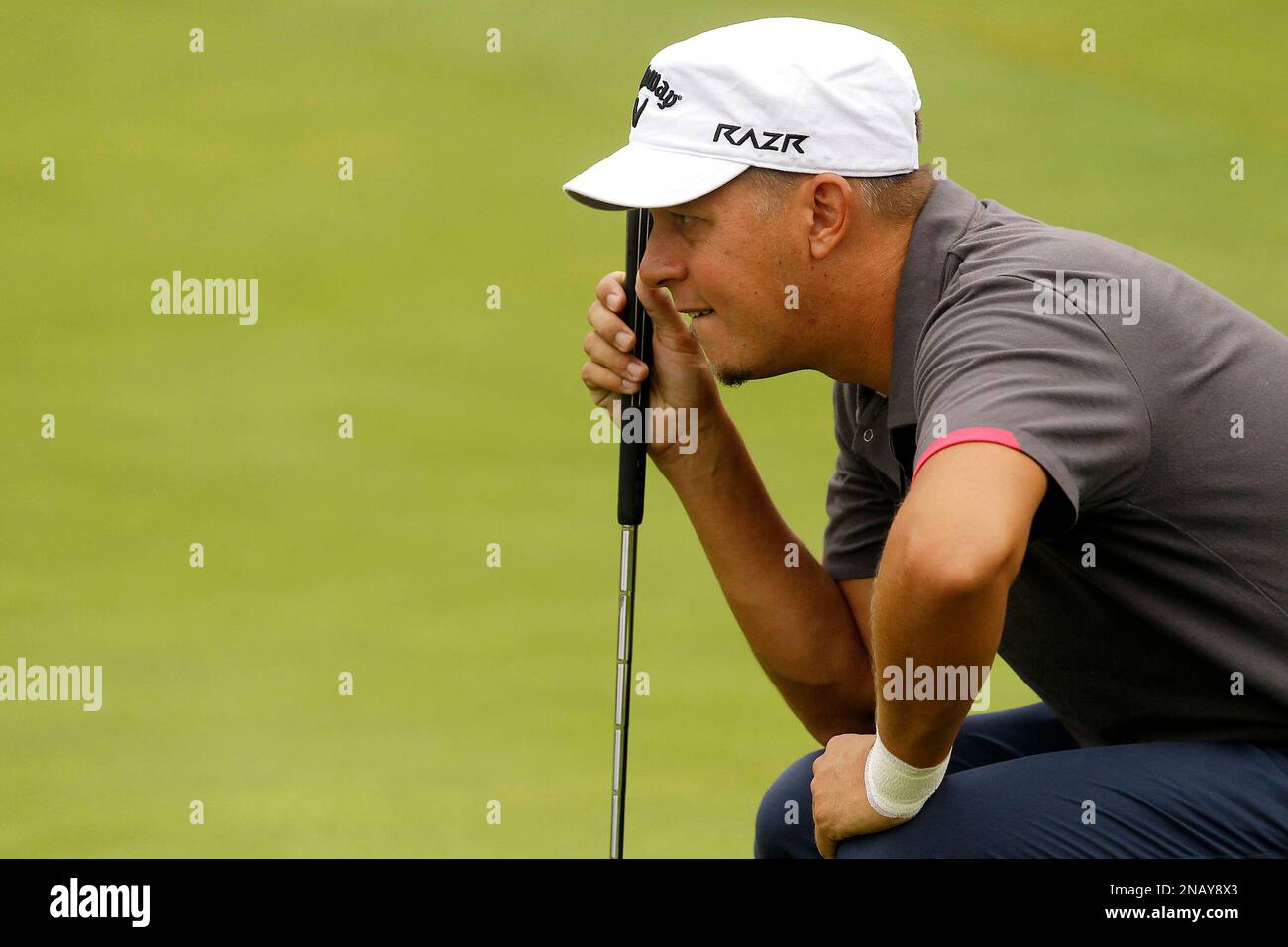Fredrik Jacobson of Sweden lines up a putt on the 11th green during the ...
