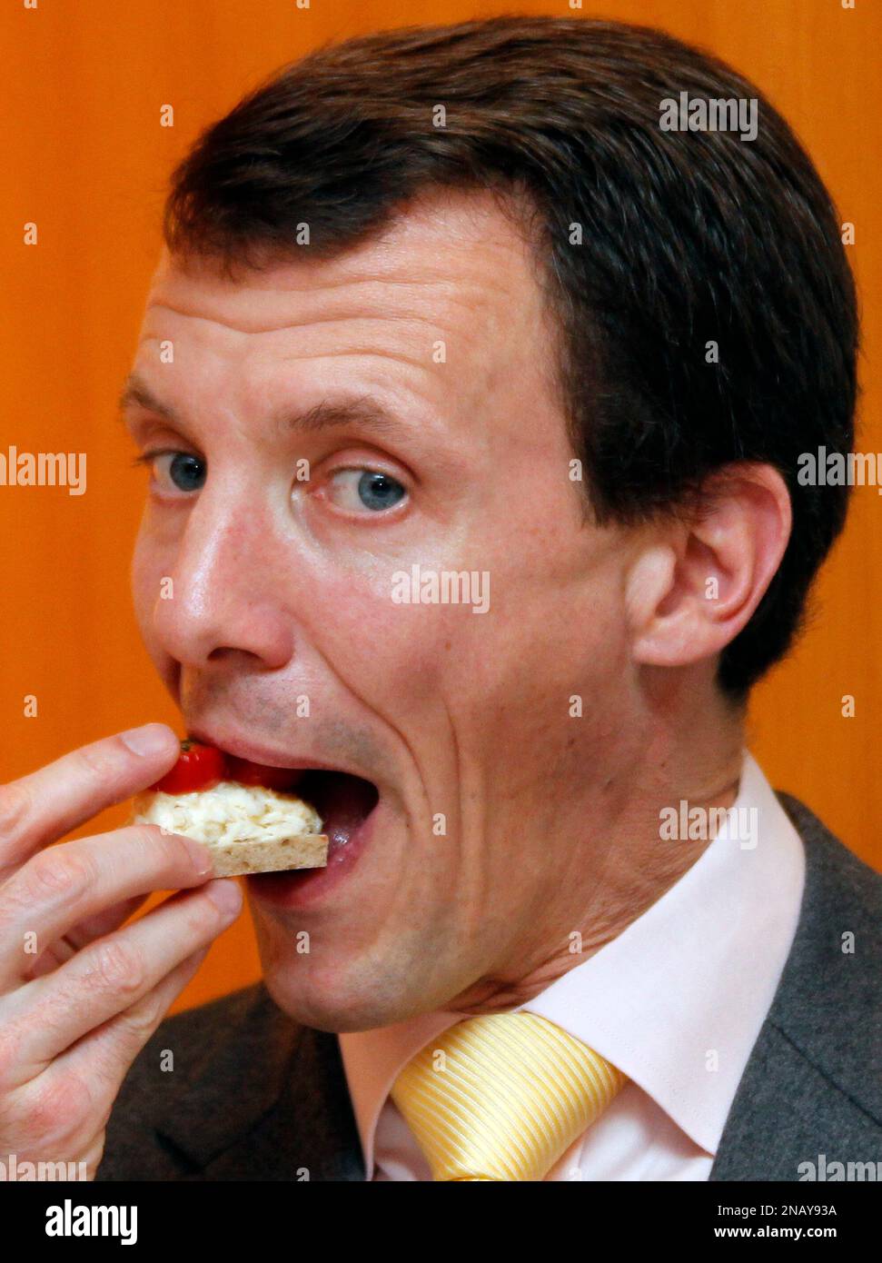 Danish Prince Joachim eats a finger food during his visit at Aoyama ...