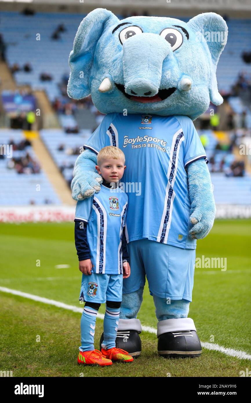 A Coventry City matchday mascot poses for a photo with Sky Blue Sam ...