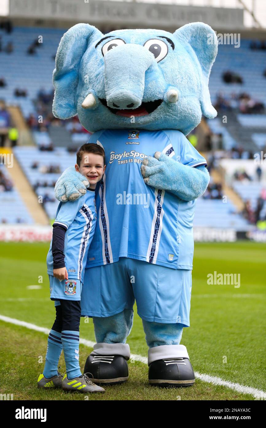 A Coventry City matchday mascot poses for a photo with Sky Blue Sam ...