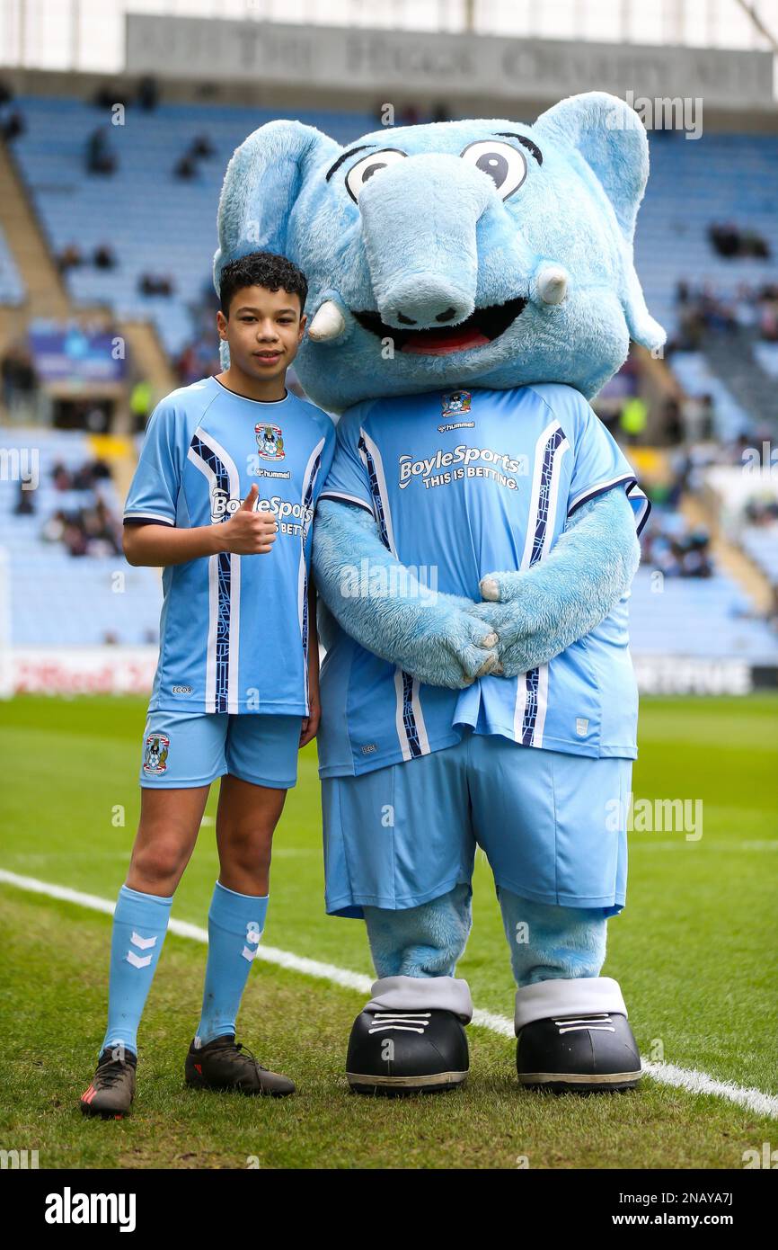 A Coventry City matchday mascot poses for a photo with Sky Blue Sam ...
