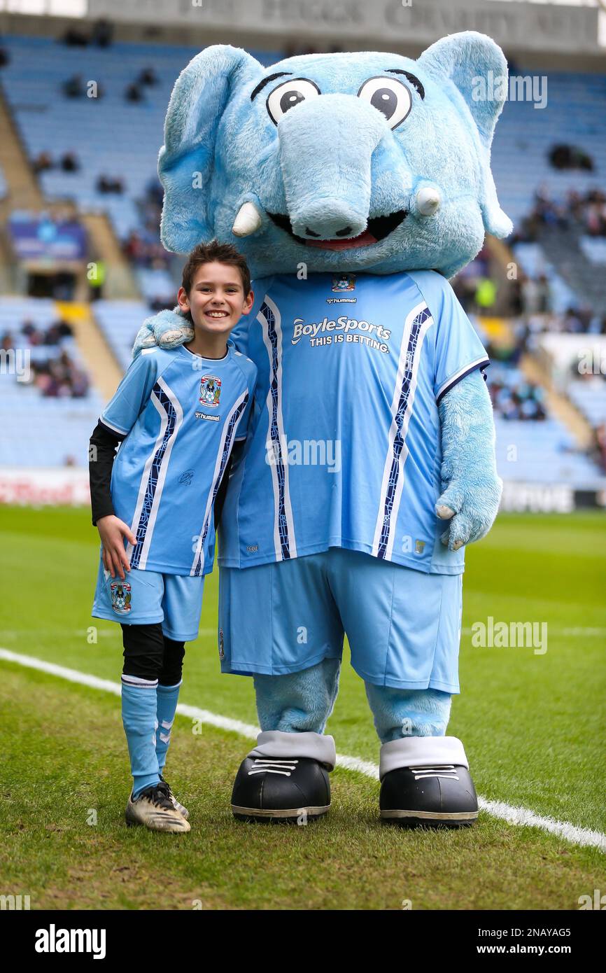 A Coventry City matchday mascot poses for a photo with Sky Blue Sam ...