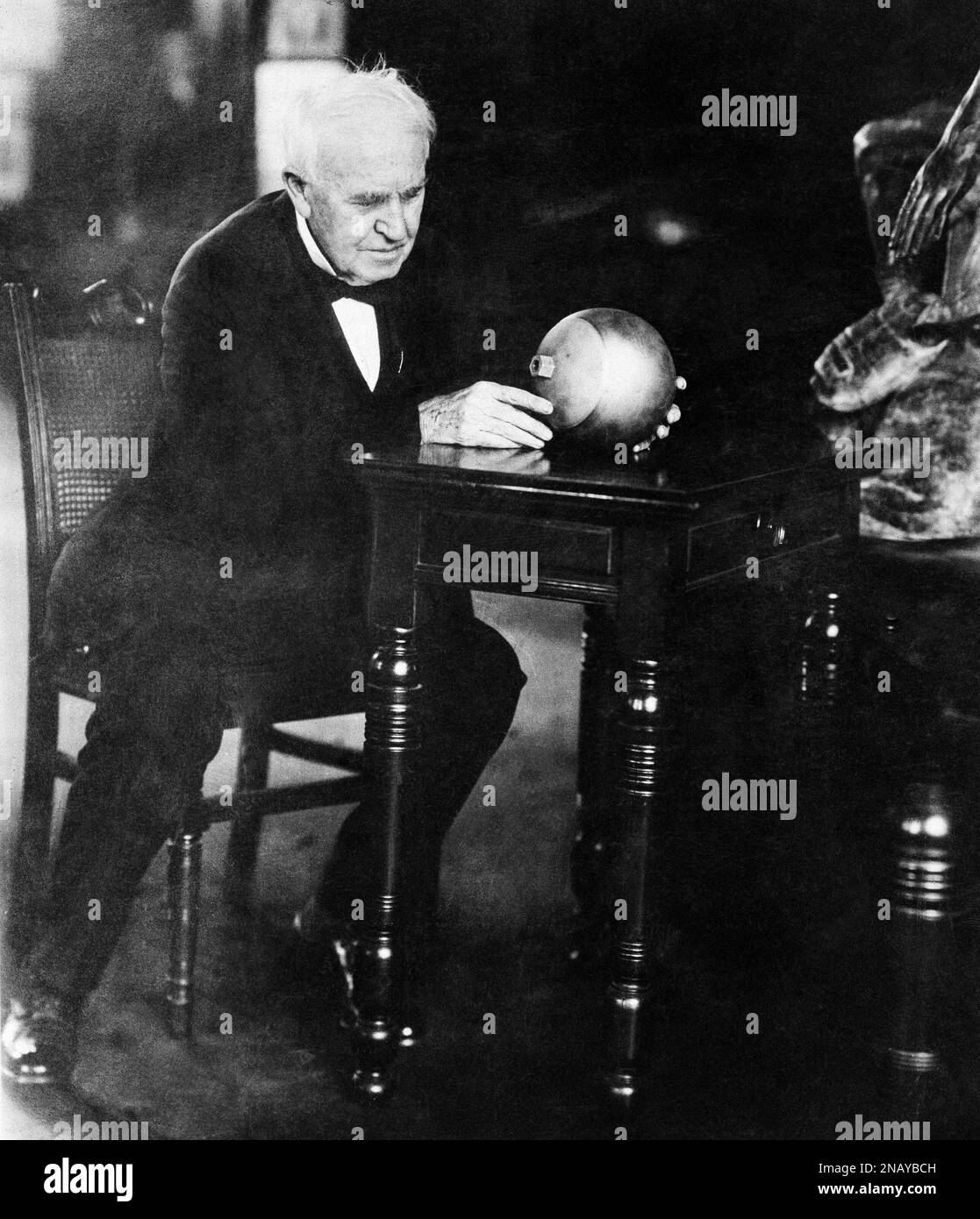Thomas Alva Edison examines one of his latest products, the Ediplate ...