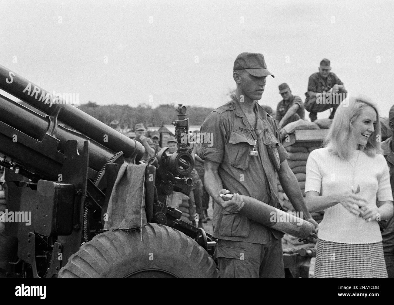Disc jockey Chris Noel, visiting U.S. military men in Vietnam, fires an ...