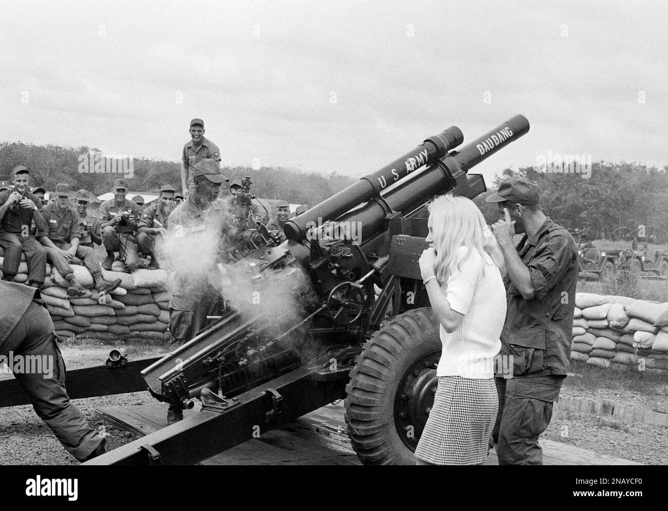 Disc jockey Chris Noel, visiting U.S. military men in Vietnam, fires an ...