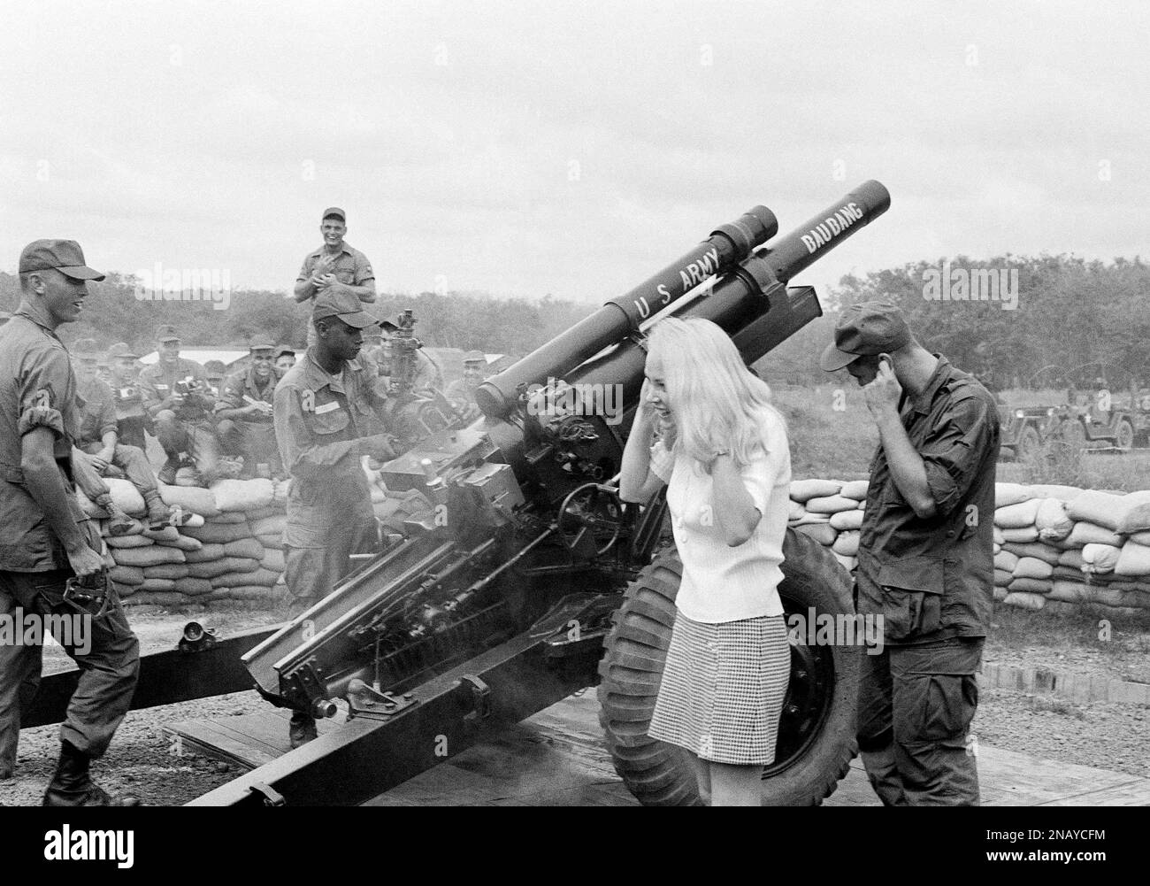 Disc jockey Chris Noel, visiting U.S. military men in Vietnam, fires an ...