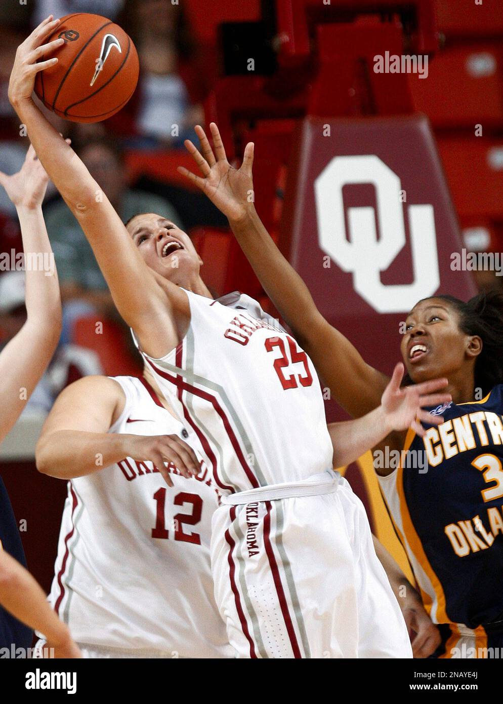 Oklahoma guard Whitney Hand, left, grabs the ball in front of Central ...