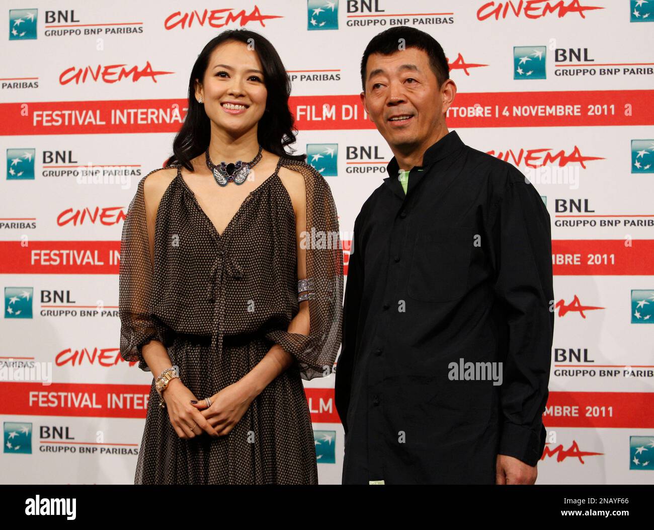 Chinese director Gu Changwei, right, and actress Zhang Ziyi pose during ...