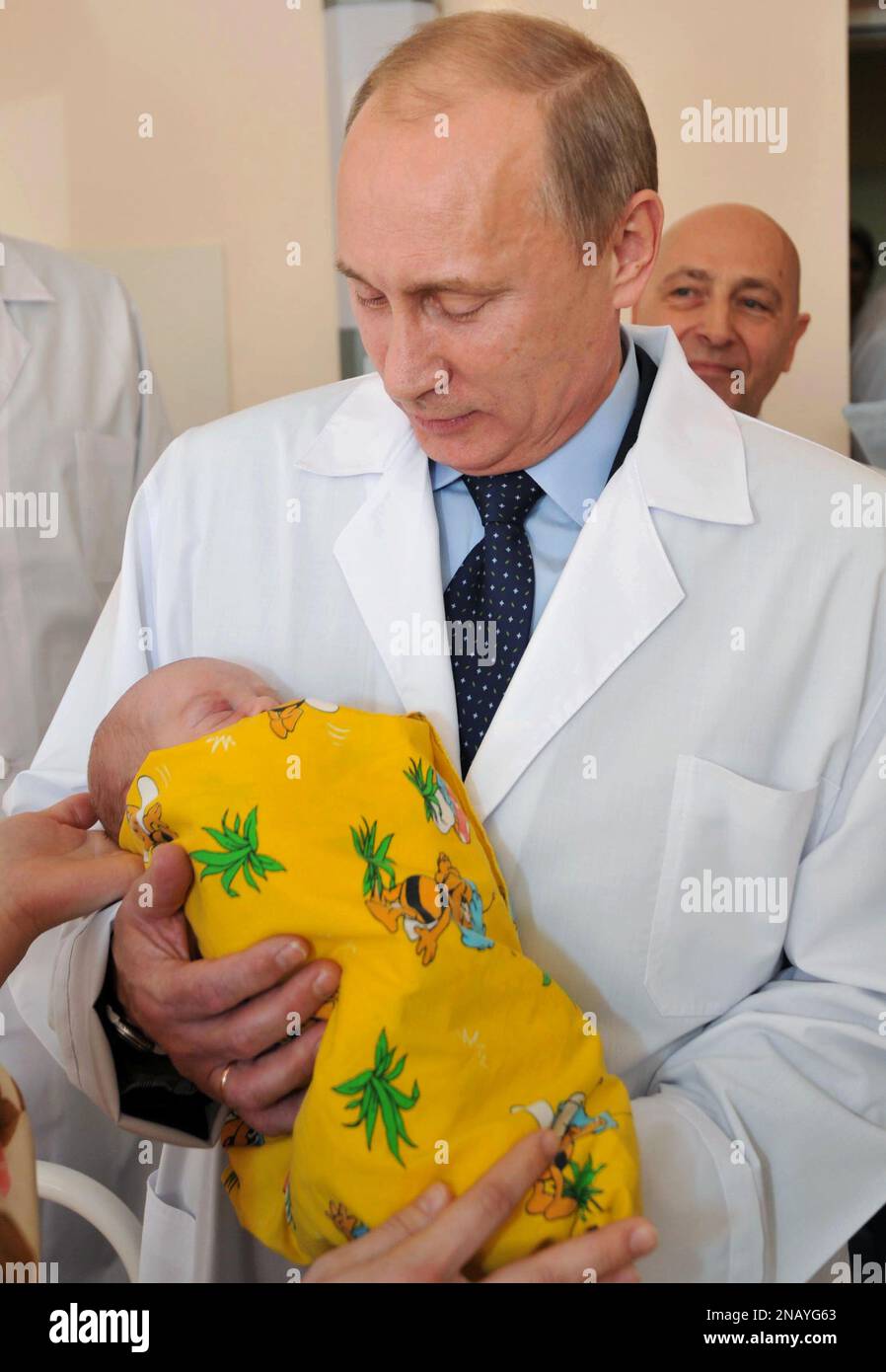 Russian Prime Minister Vladimir Putin holds baby boy Pyotr in a ...