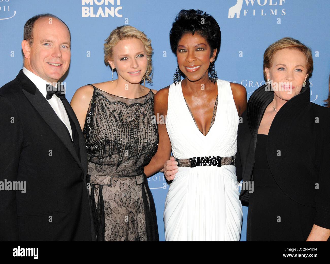 Prince Albert II and Princess Charlene of Monaco pose with singer ...