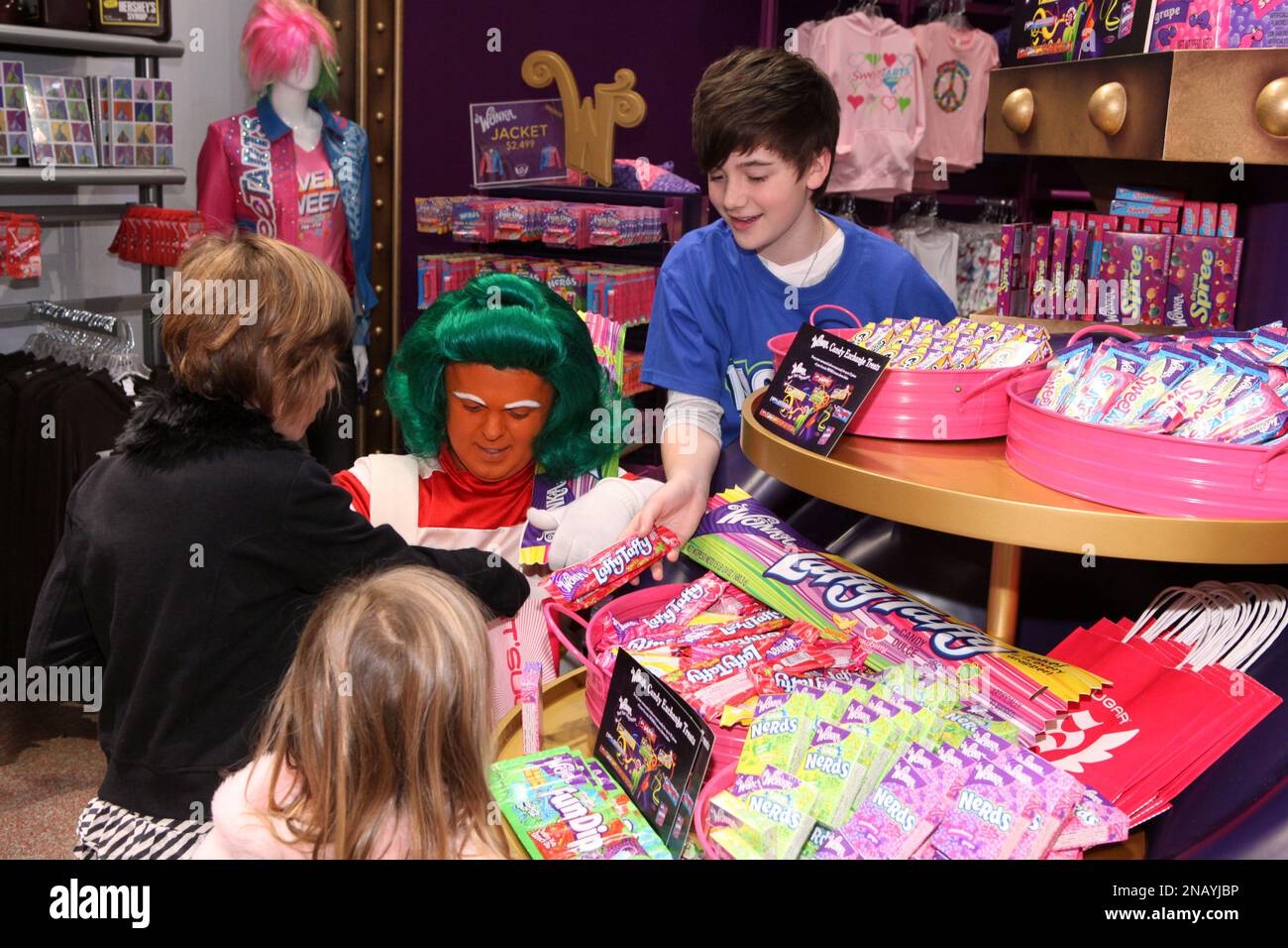 Greyson Chance and other trick-or-treaters swap candy with an Oompa ...