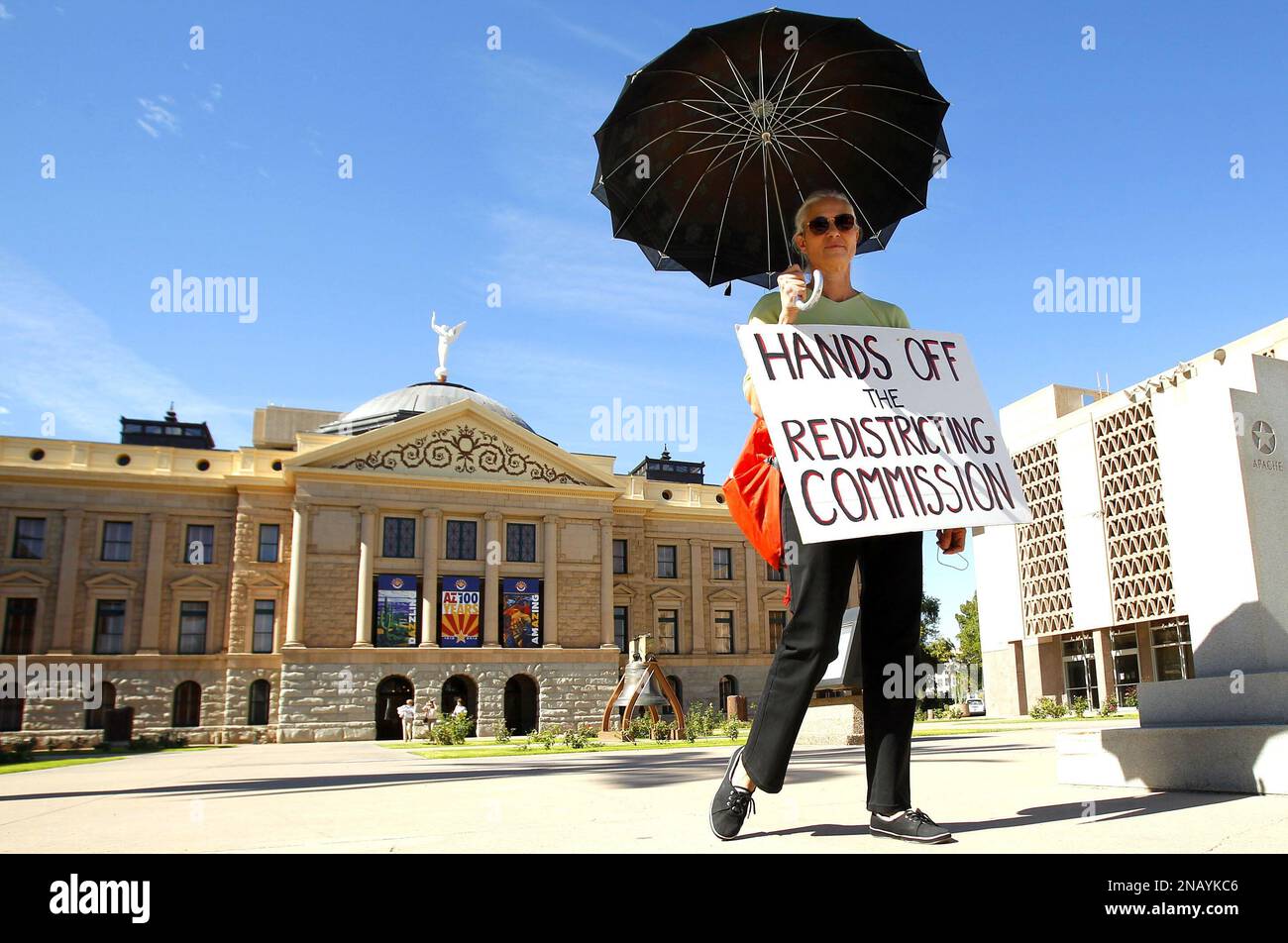 Elizabeth Bernstein, of Bisbee, Ariz., walks in front of the Arizona ...