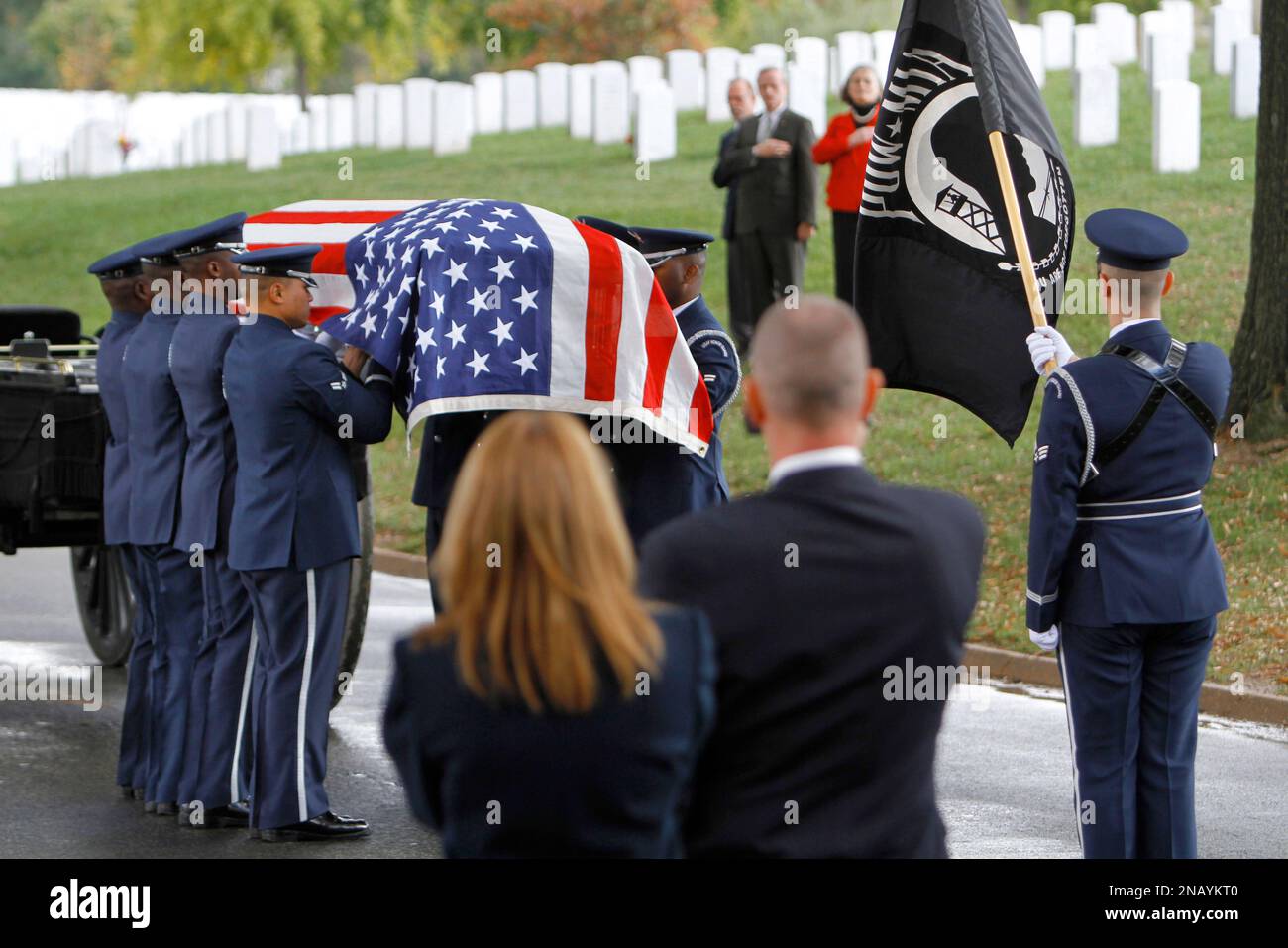 The casket of Air Force Col. Gilbert S. Palmer, Jr., is lifted for ...