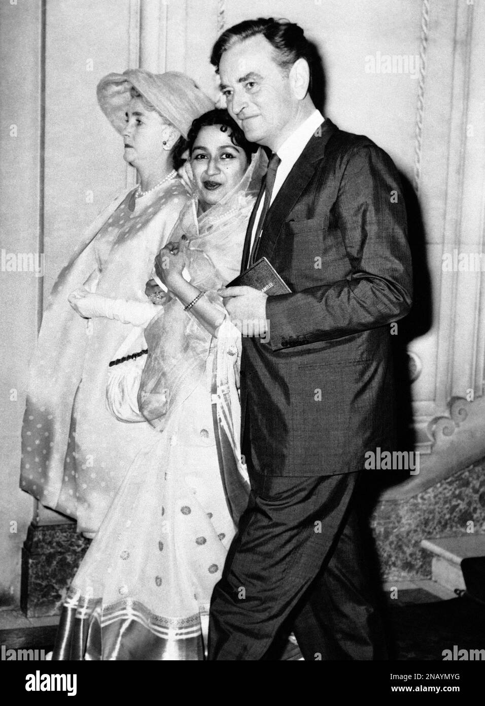 Barbara Hutton (left), the bride, Leila Devi wearing an Indian sari and ...