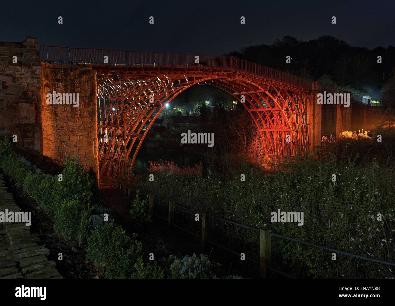 The iconic Iron Bridge over the River Severn in Shropshire, England lit ...