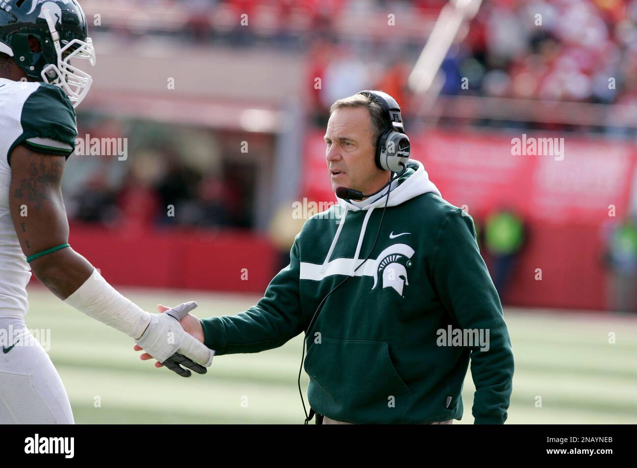 Michigan States' head coach Mark Dantonio, right, congratulates William ...