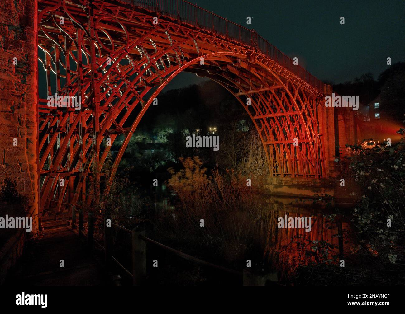 The iconic Iron Bridge over the River Severn in Shropshire, England lit ...