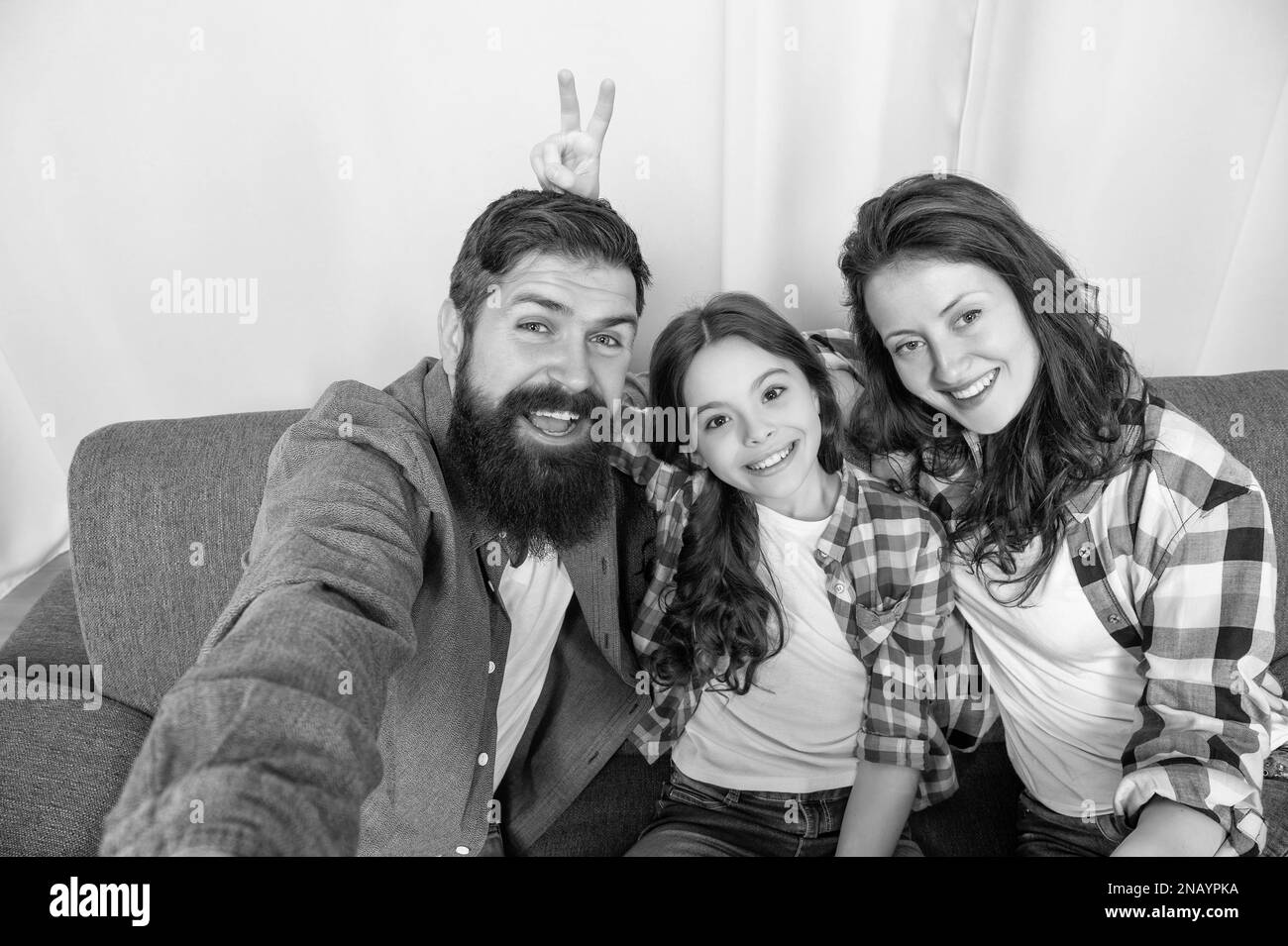 happy parents with kid at home. mom dad and daughter love relax ...