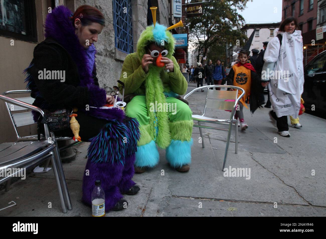 Bern Blackburn, second from left, adjusts his costume as he and Jill ...