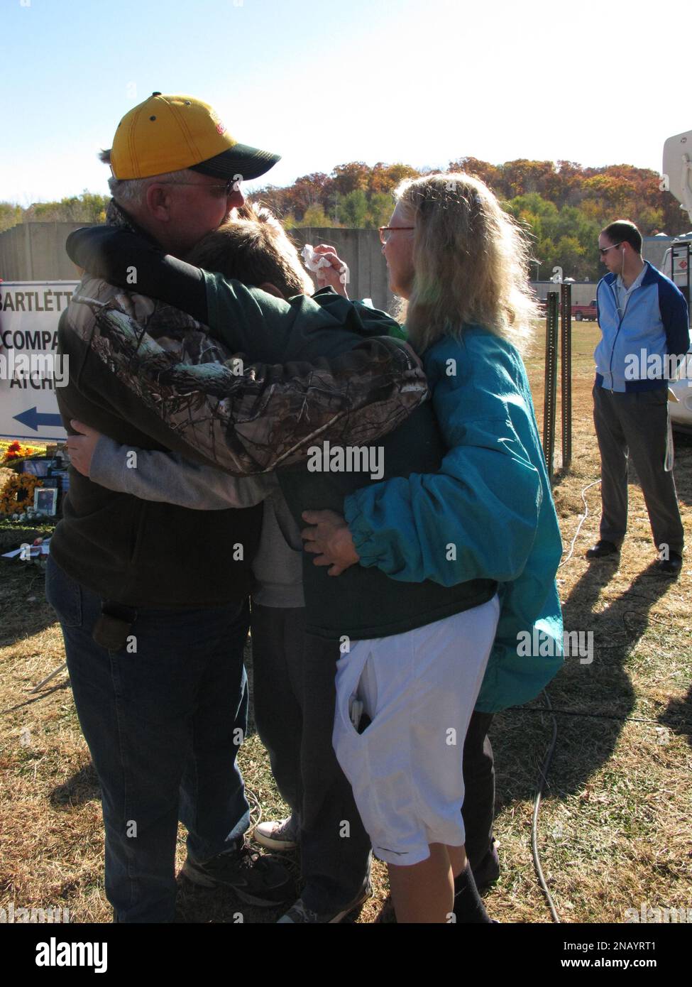 Gary Keil, left, and Ramona Keil, right, hug two of their grandchildren ...