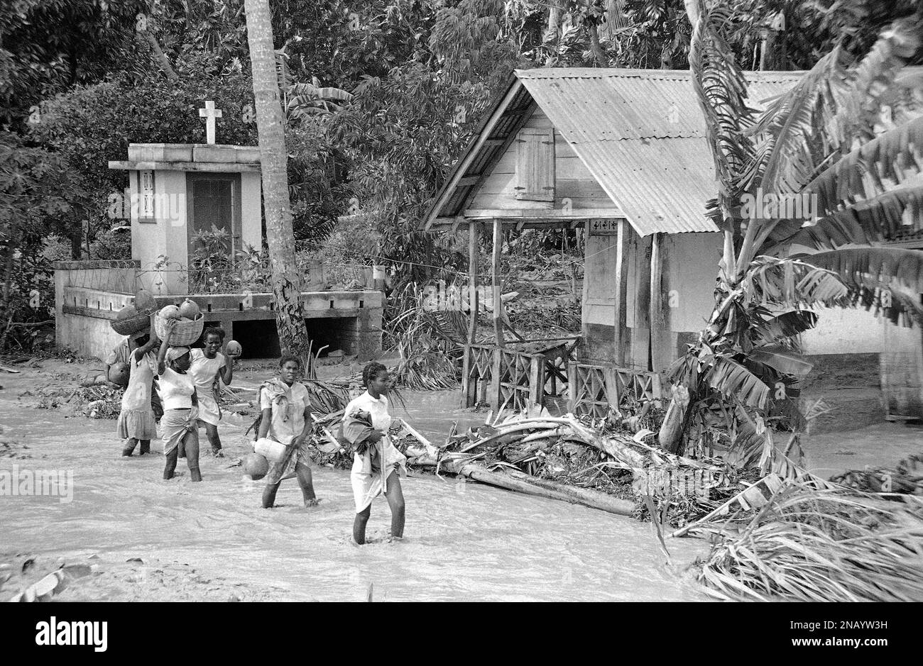 Residents of a village on the southern coast of the Caribbean island of ...
