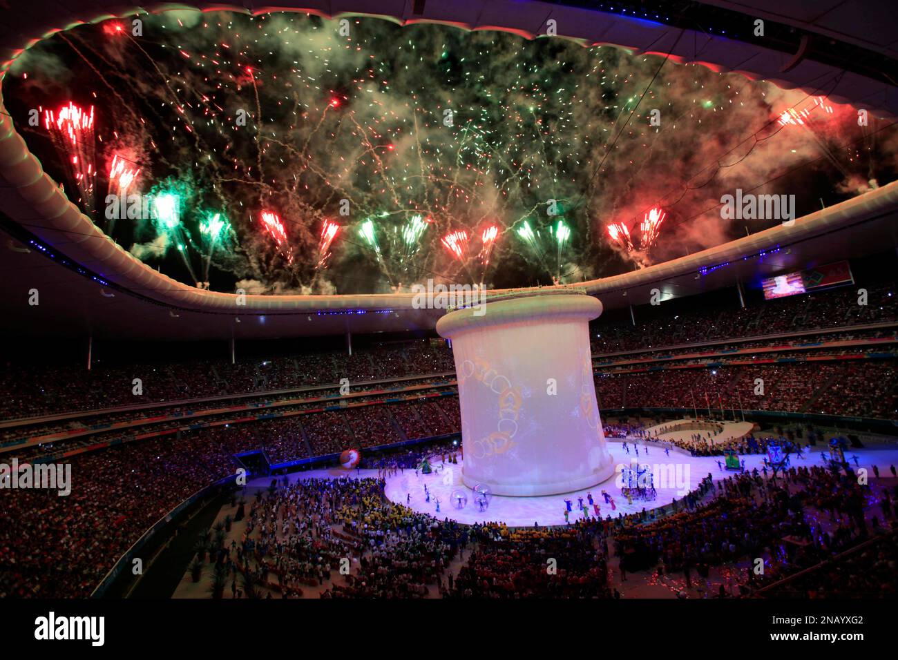 Fireworks explode over the Omnilife stadium during the closing ceremony ...