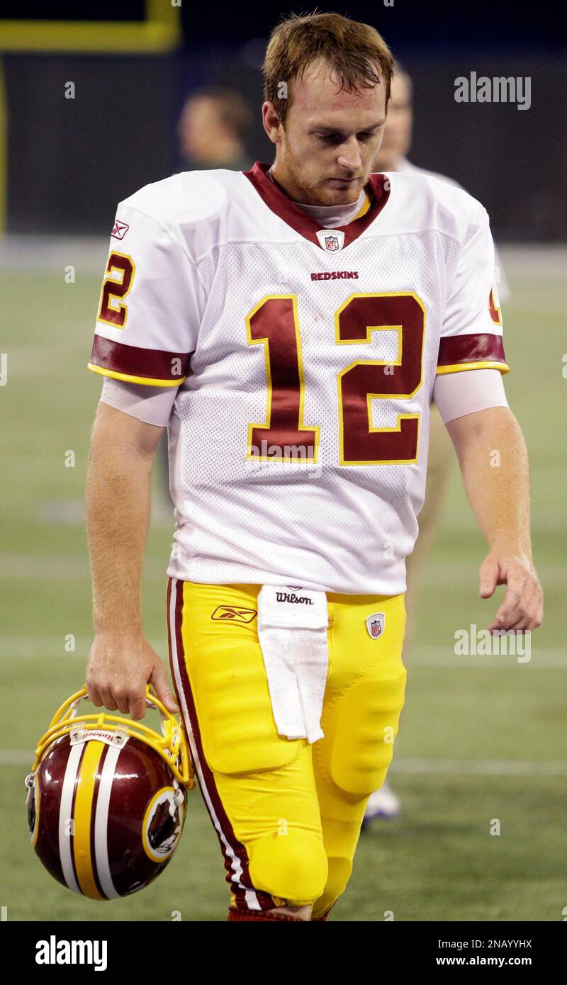 Washington Redskins quarterback John Beck walks off the field after an ...