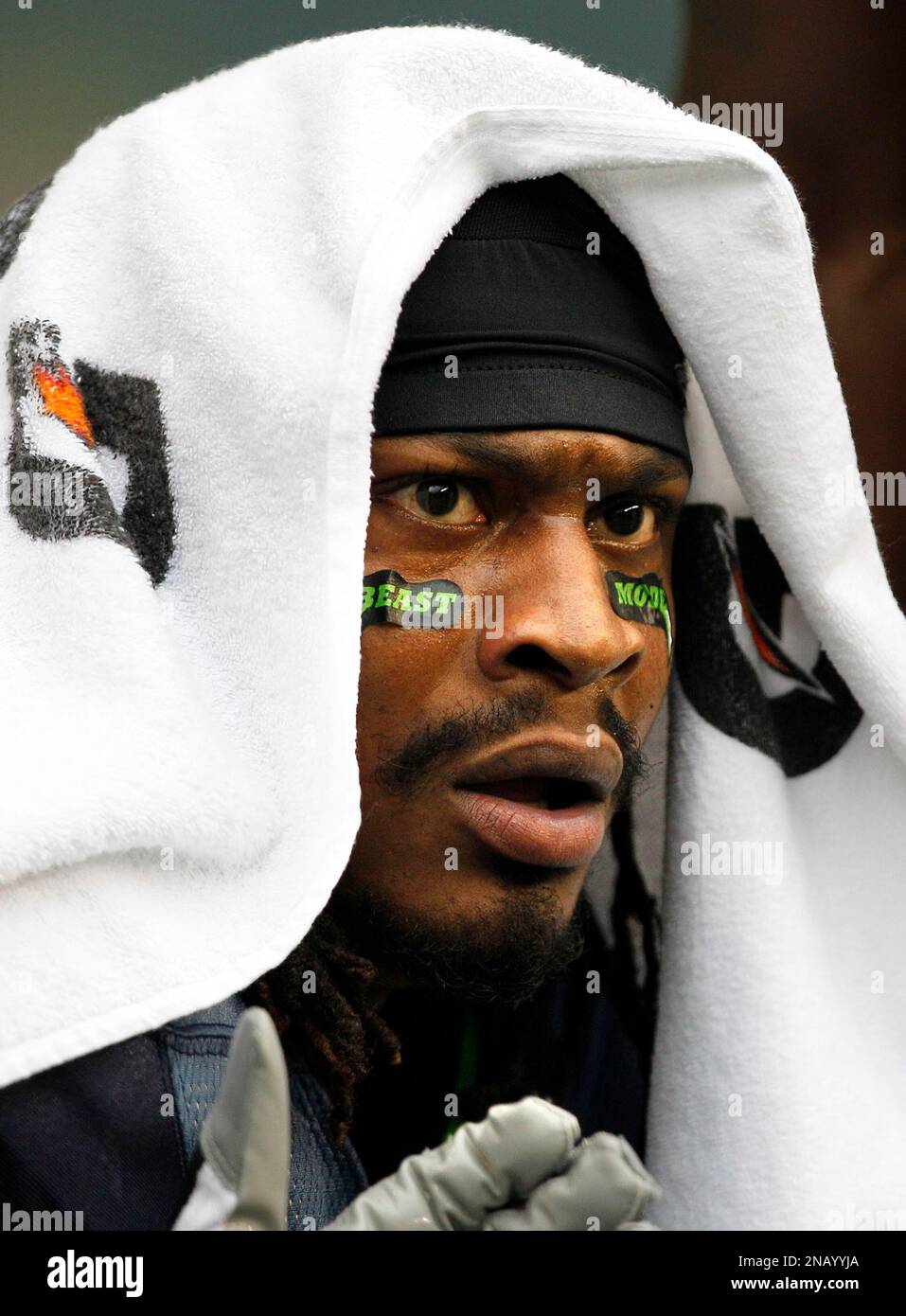 Seattle Seahawks' Marshawn Lynch watches from the side lines the second ...