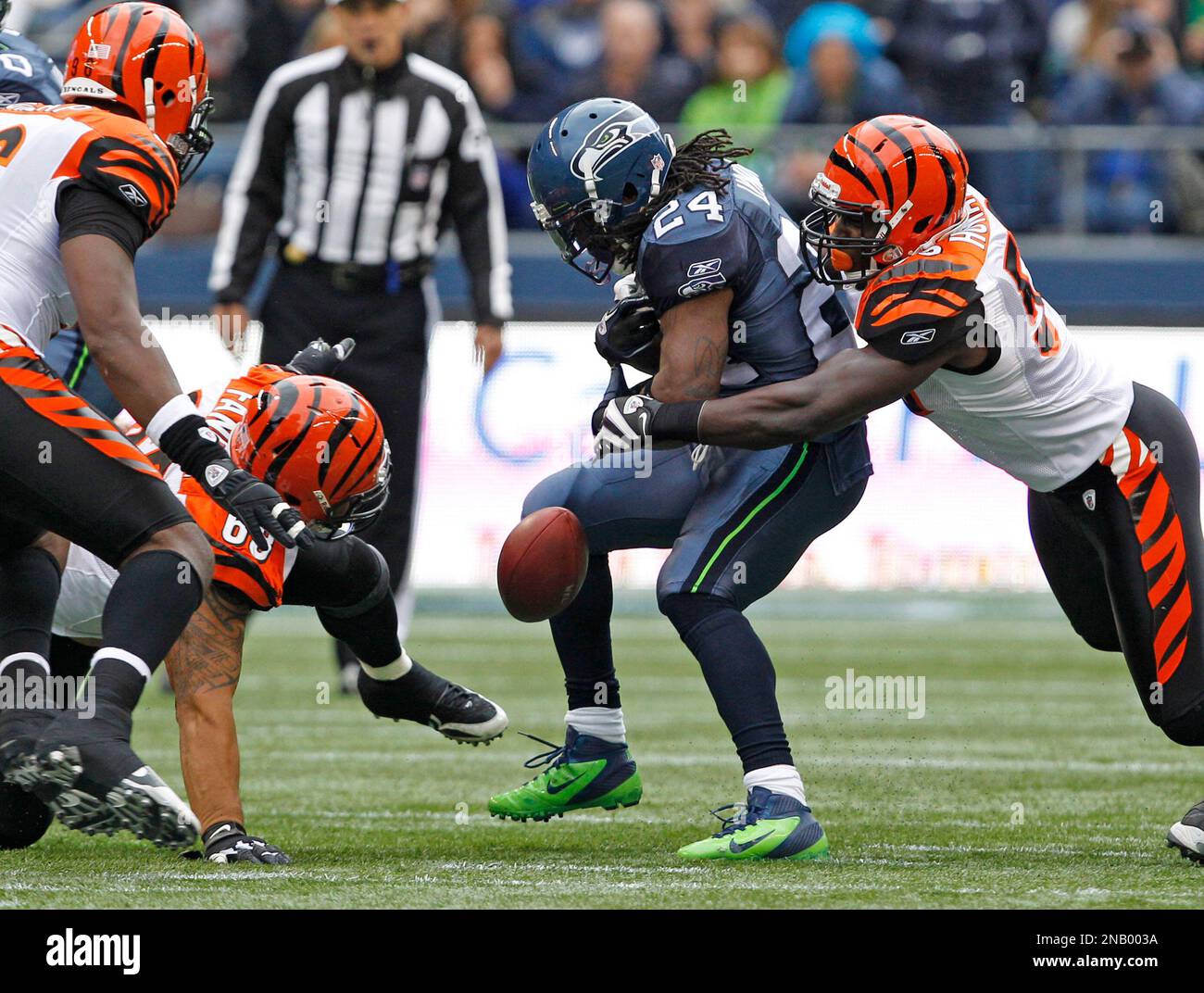 Seattle Seahawks' Marshawn Lynch (24) has the ball stripped by ...