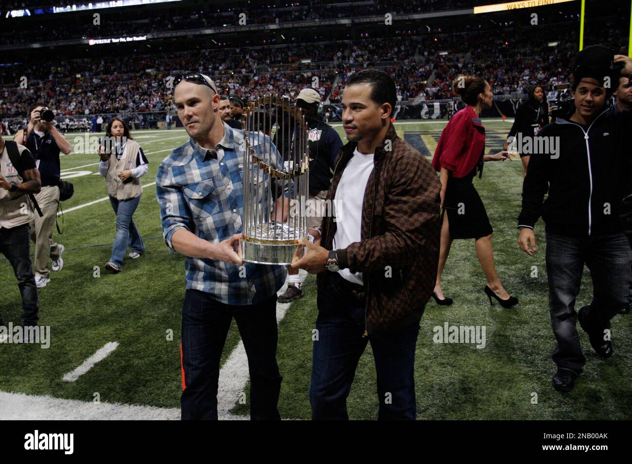 St. Louis Cardinals Skip Schumacher, left, and Rafael Furcal cary the ...