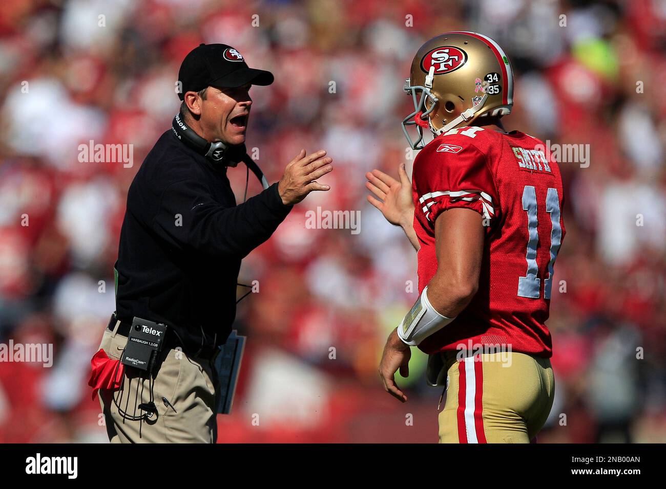San Francisco 49ers head coach Jim Harbaugh greets quarterback Alex ...