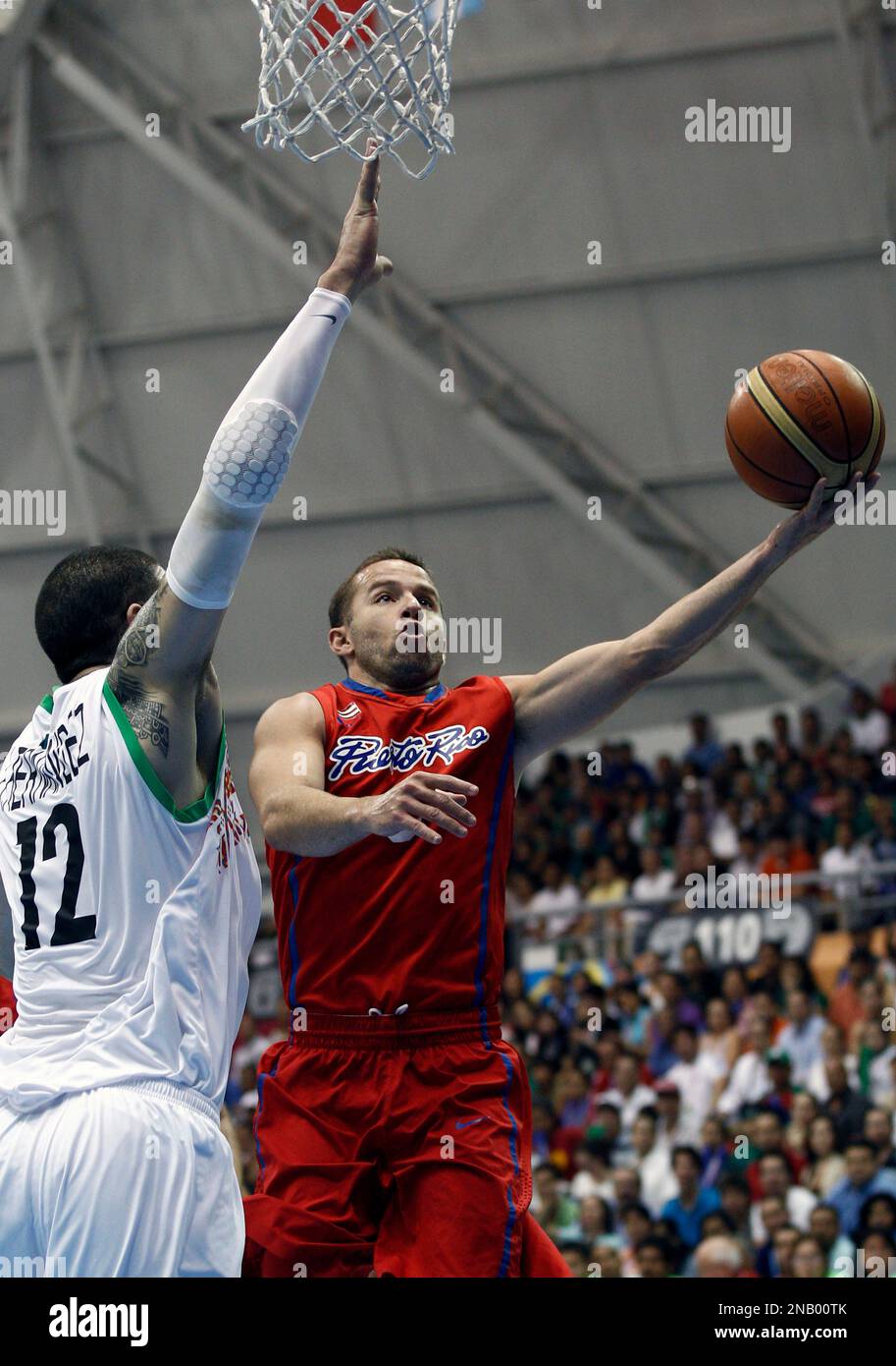 Puerto Rico's Jose Barea drives the ball next to Mexico's Hector ...