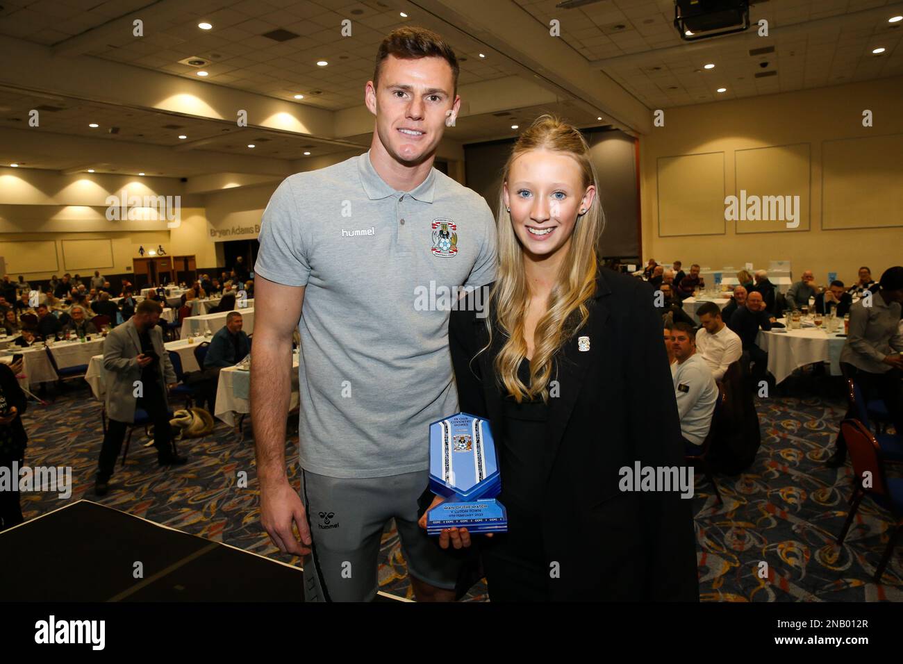 Coventry City goalkeeper Ben Wilson receives his MOTM award following ...