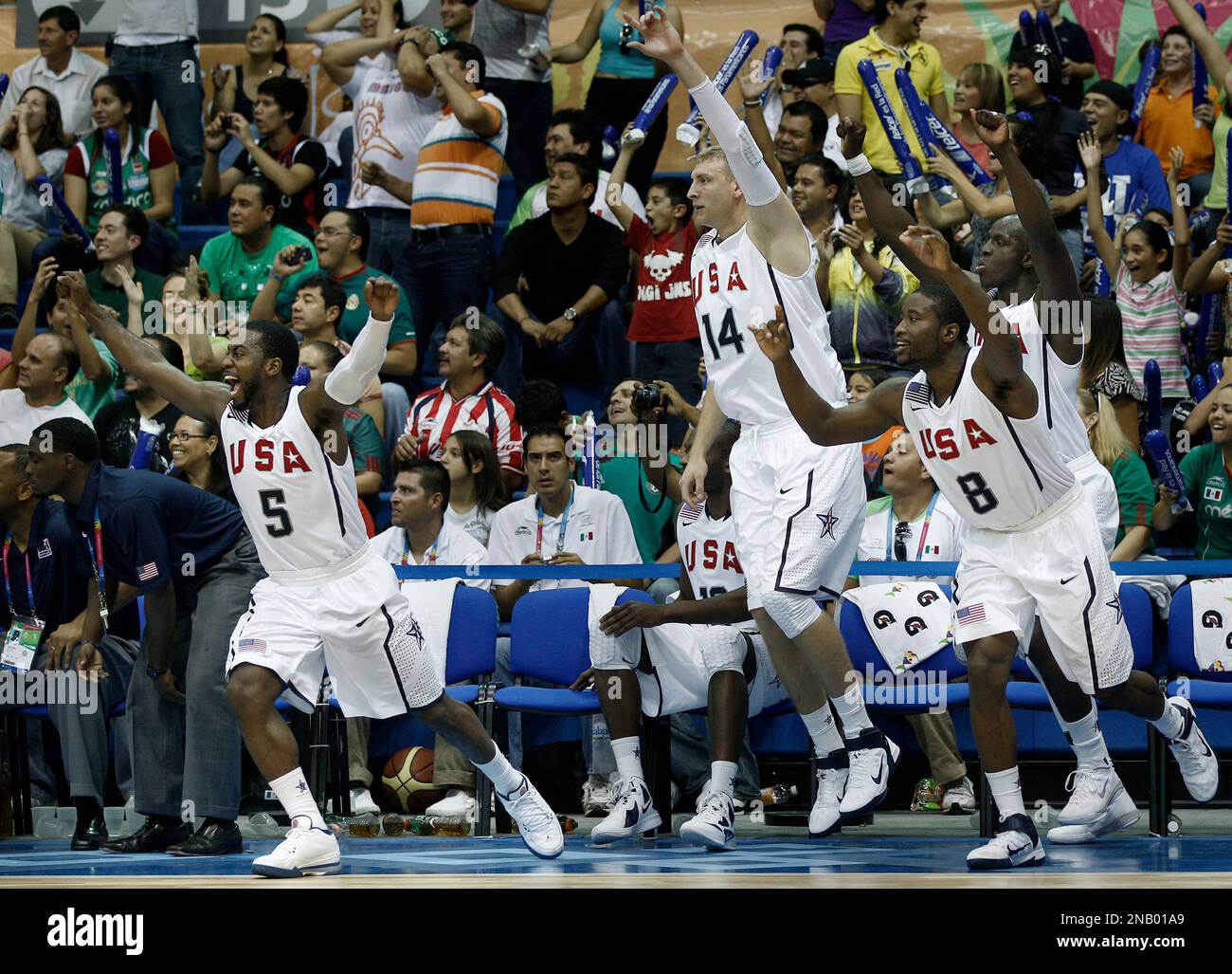 Members of the basketball team of the United States celebrate after ...