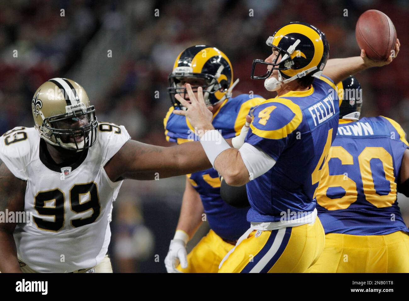 St. Louis Rams quarterback A.J. Feeley (4) throws under pressure from ...